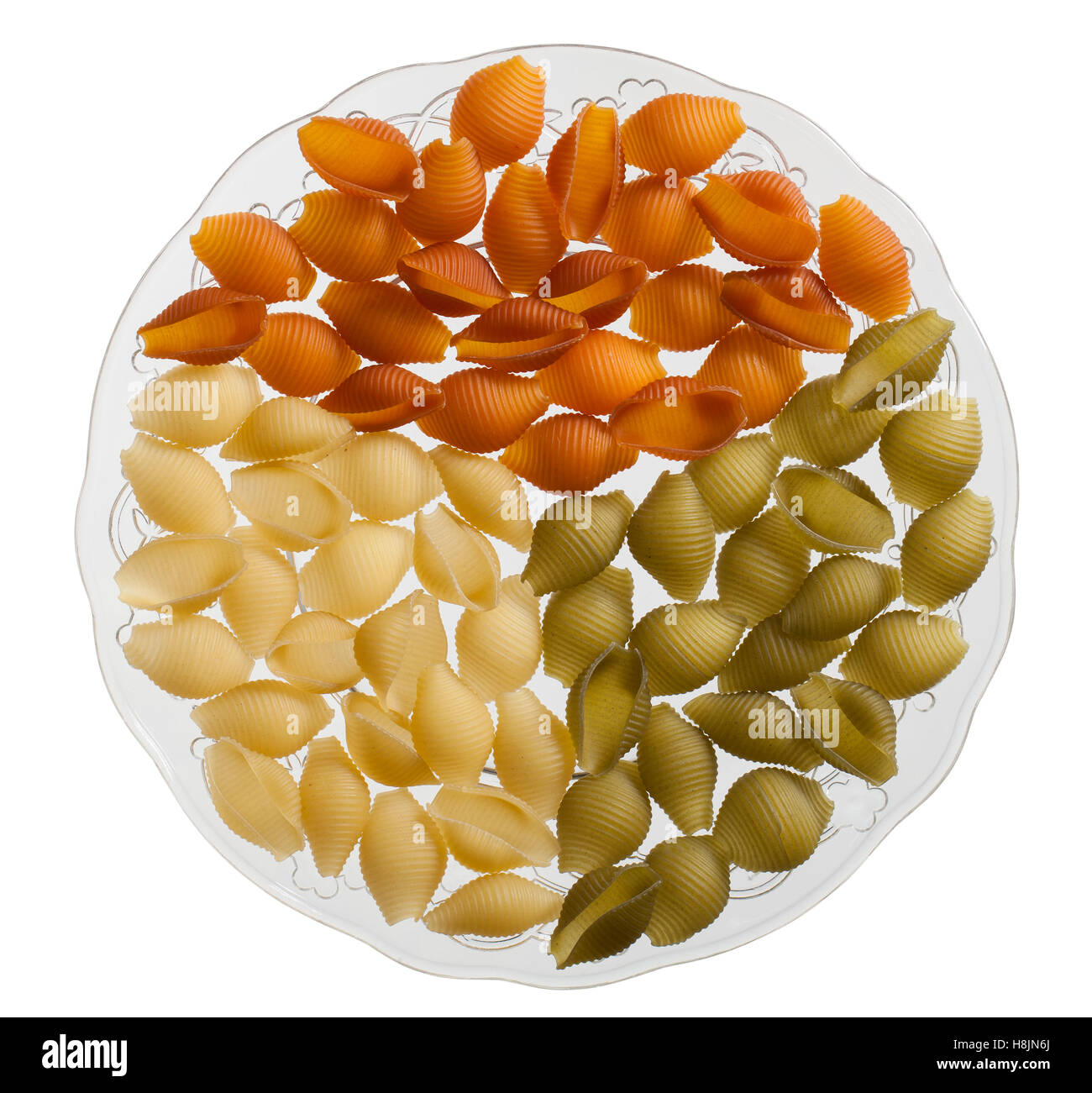 Shell pasta on glass dish isolated on white background Stock Photo - Alamy