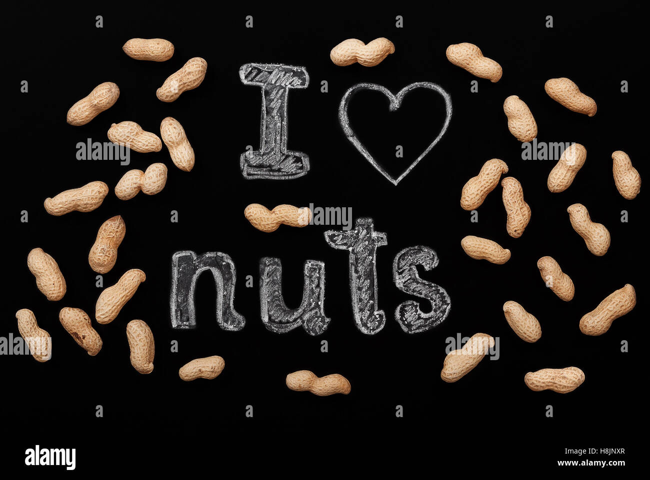 Peanuts on a black background and chalk inscription "I love nuts Stock ...