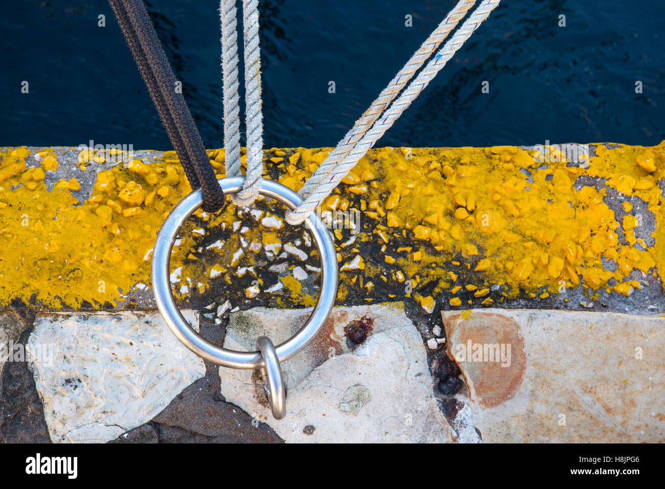 three knots attaching to one ring Stock Photo - Alamy