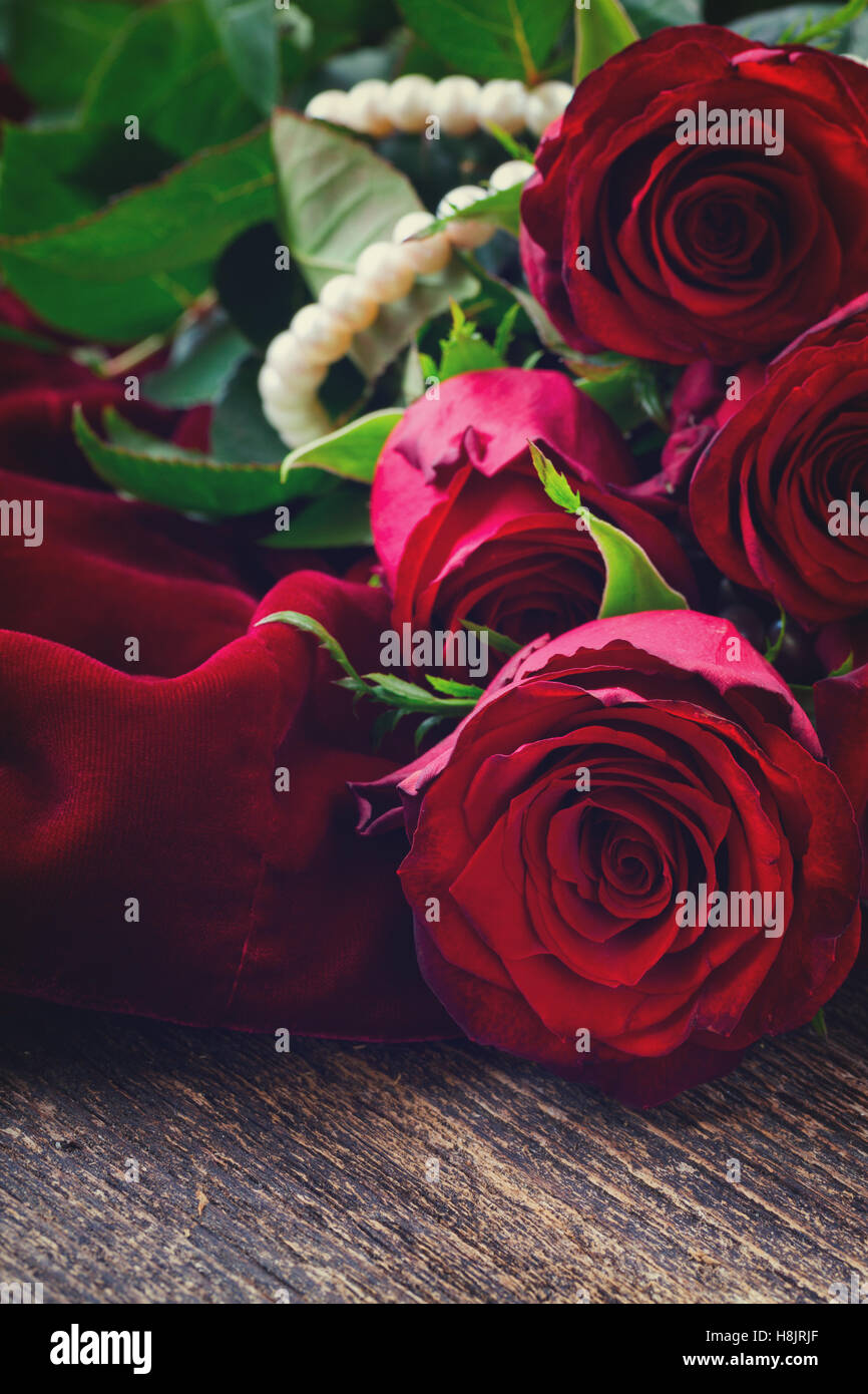 red roses on velvet Stock Photo - Alamy