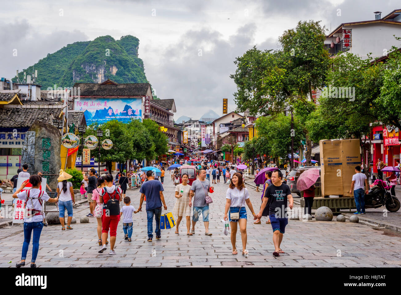 View over downtown of Yangshuo with people on the street and ...