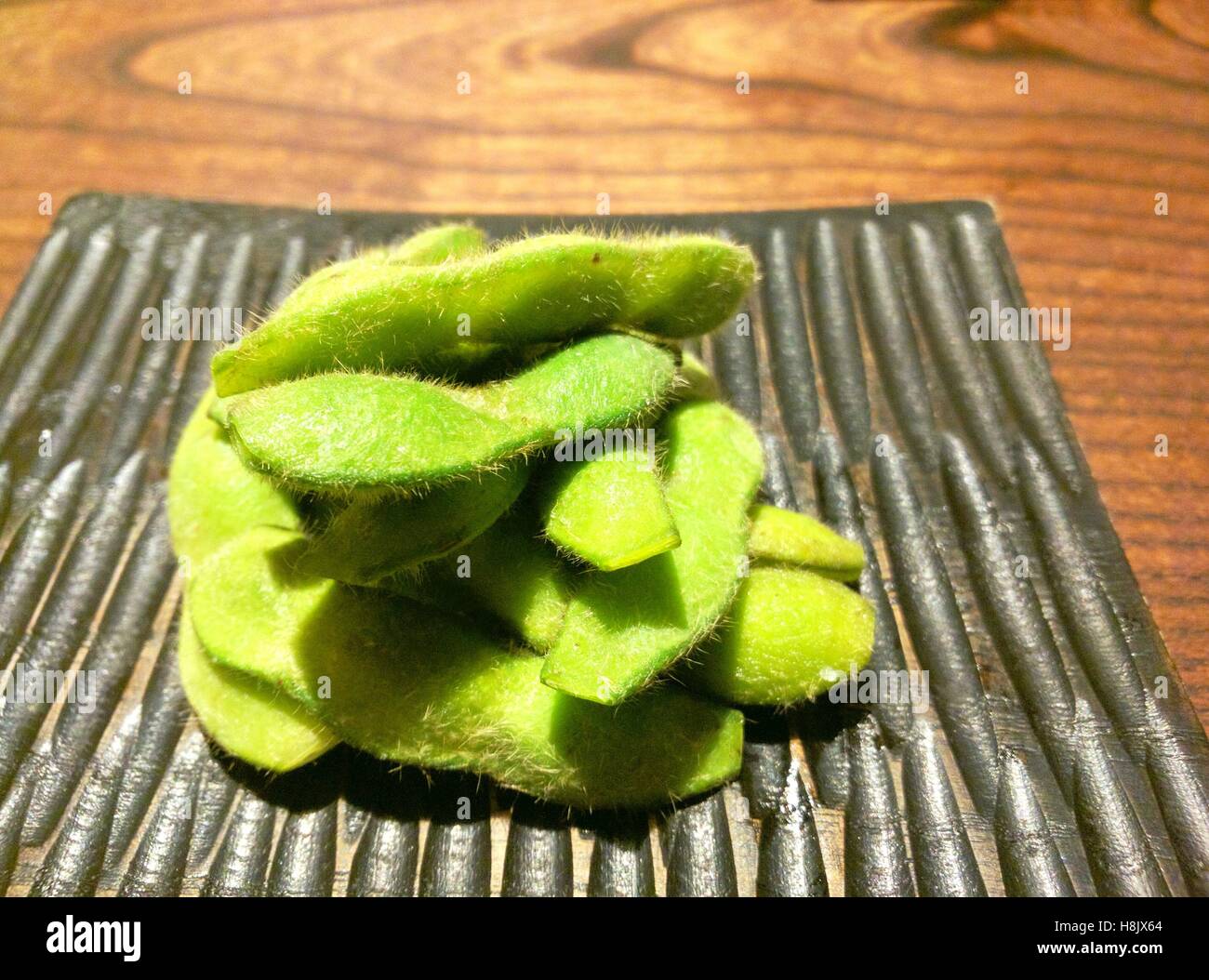 Edamame closeup, Japanese soybeans on a plate Stock Photo - Alamy