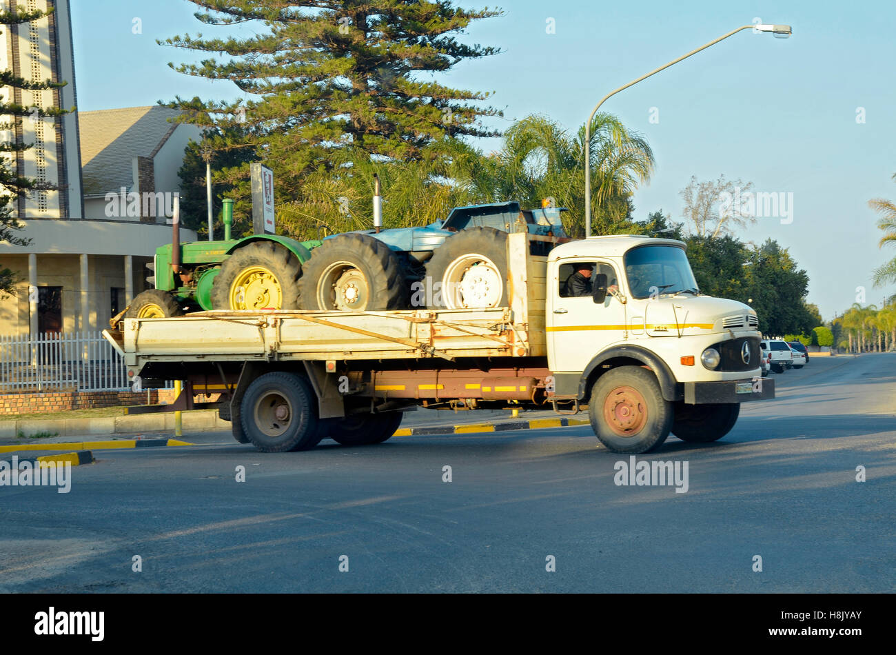 Truck carrying tractors hi-res stock photography and images - Alamy