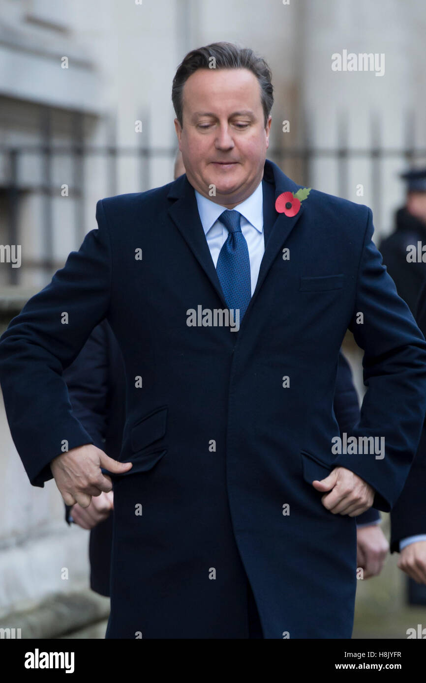 Former Prime Minister David Cameron walks through Downing Street on his ...