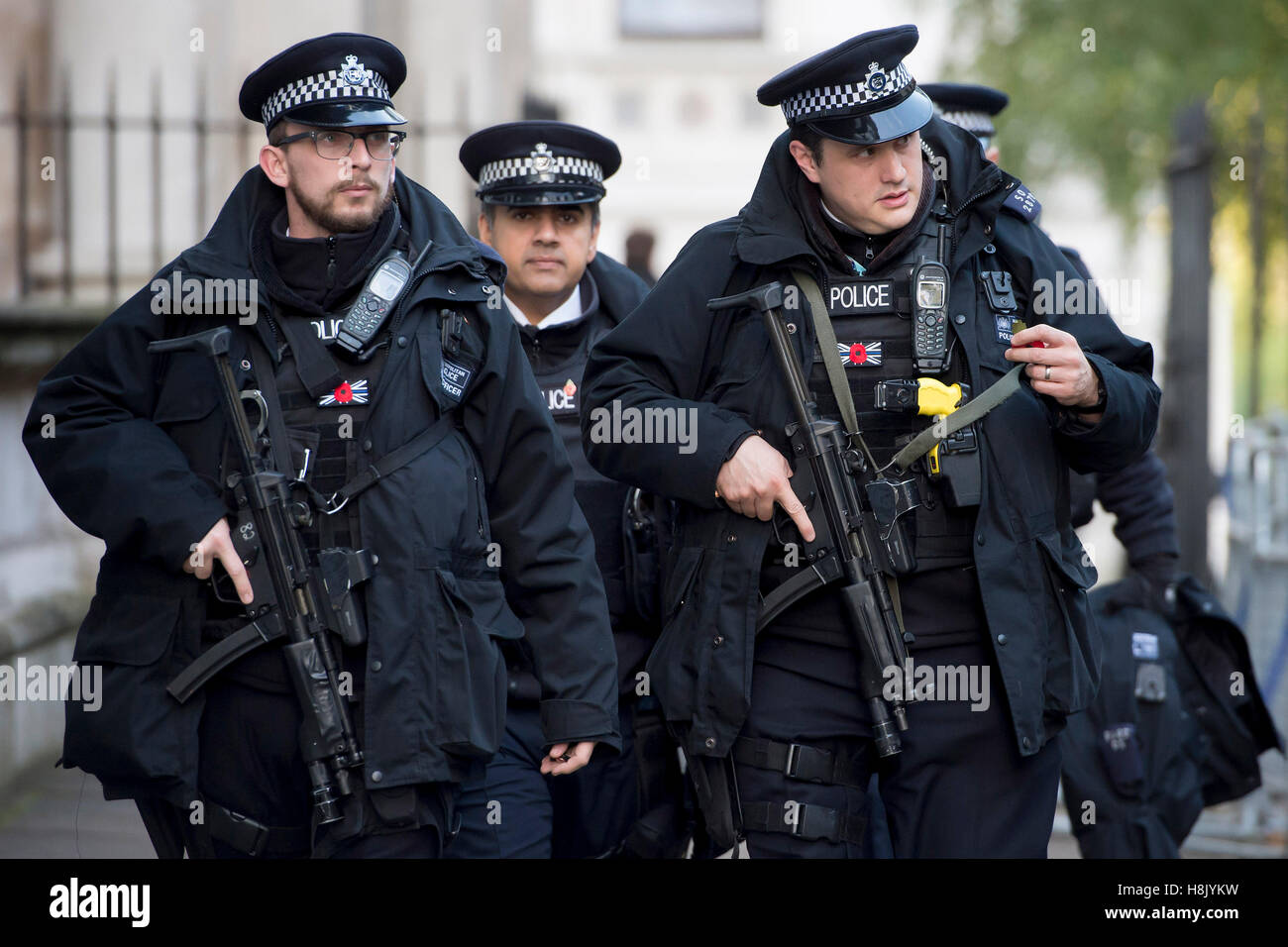 Armed police arrive in Downing Street for the annual Remembrance Sunday ...