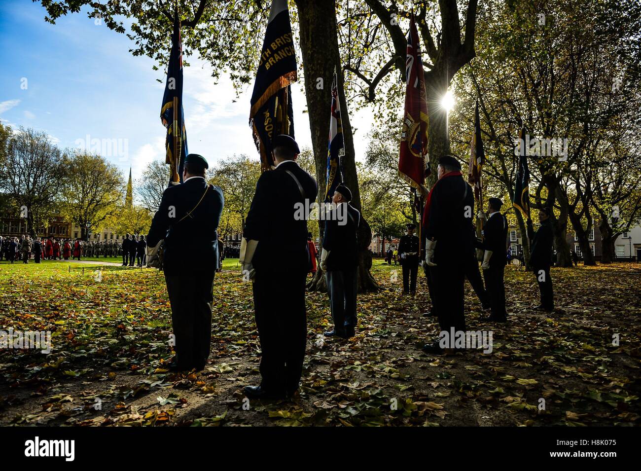 Royal British Legion standard bearers stand to attention while on ...