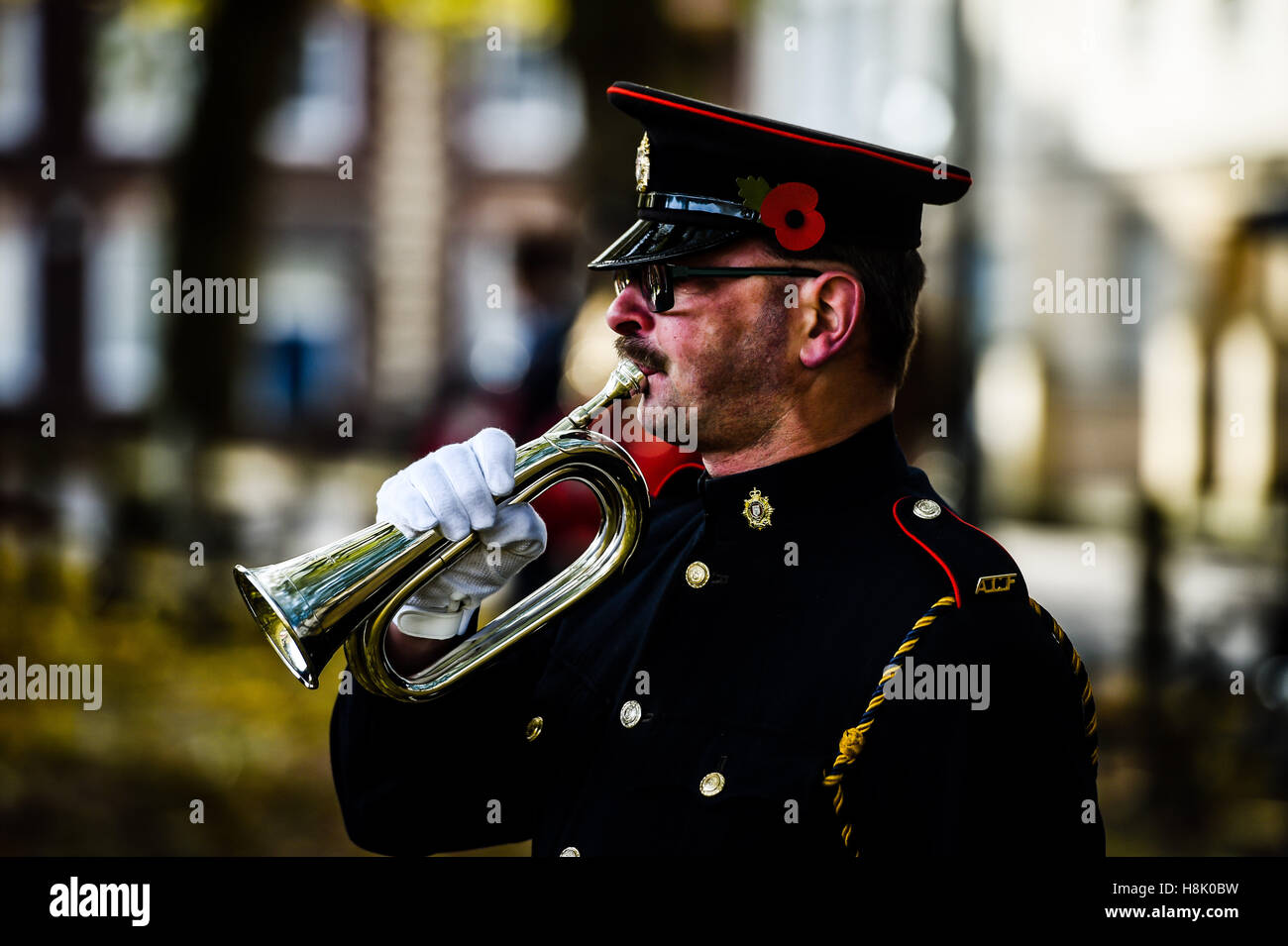 The bugler plays to indicate the end of the two minutes silence during ...
