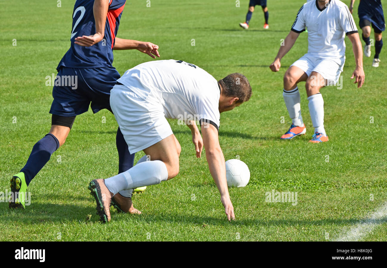 Soccer players in action during a match Stock Photo - Alamy