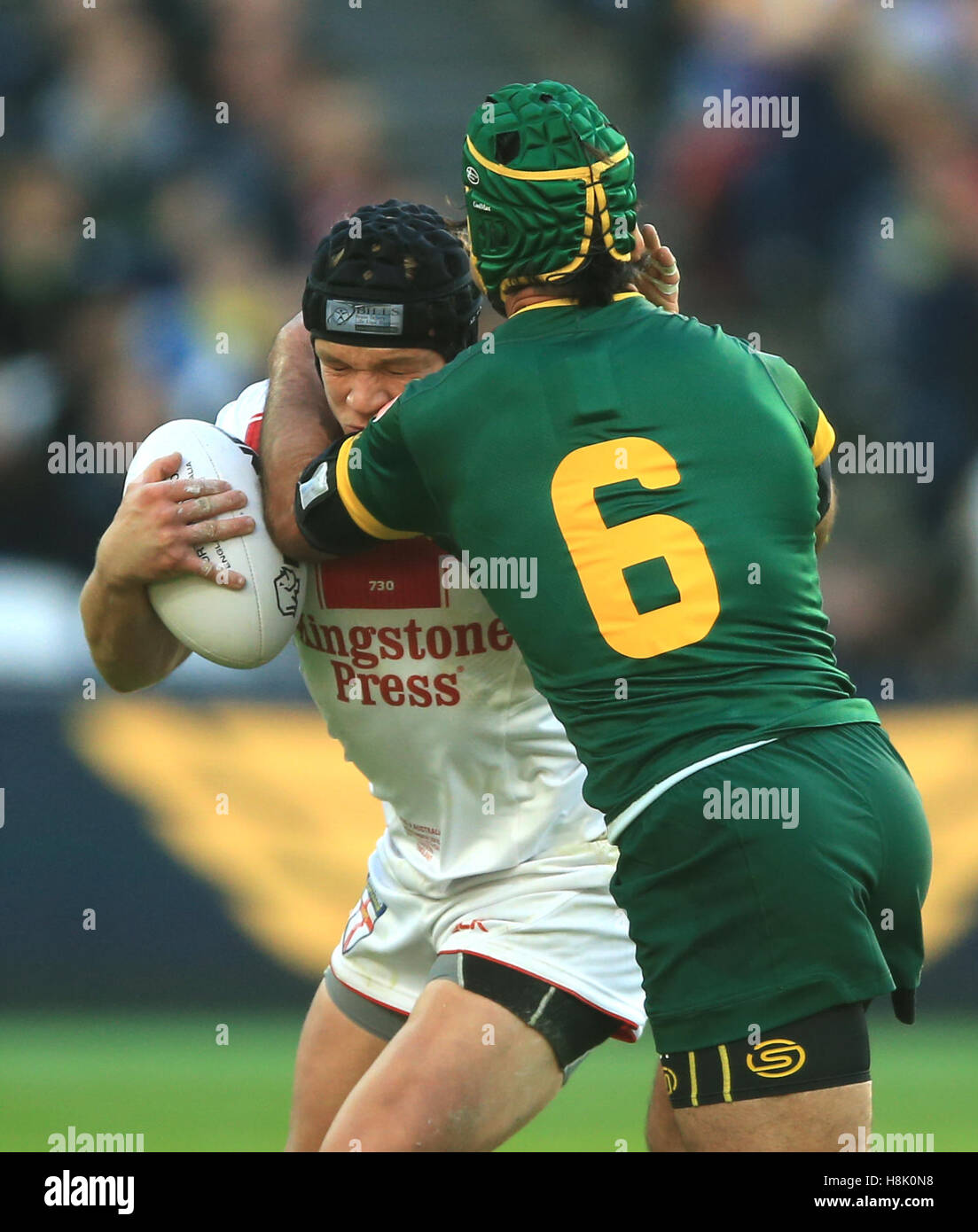 England's Jonny Lomax is tackled by Australia's Jonathan Thurston ...