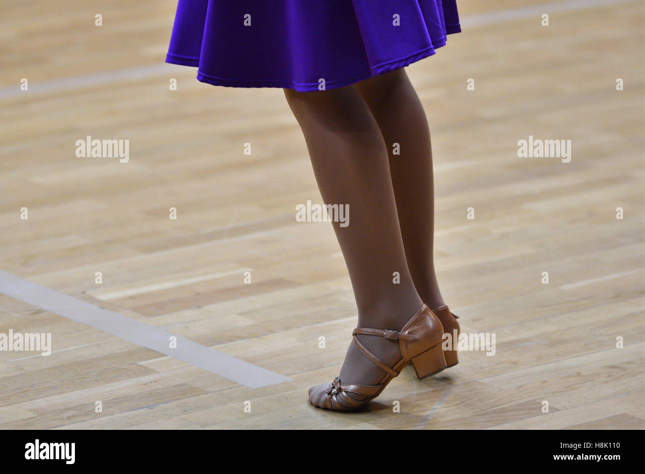 Legs of a dancing girl in the competition on sports dances Stock Photo ...
