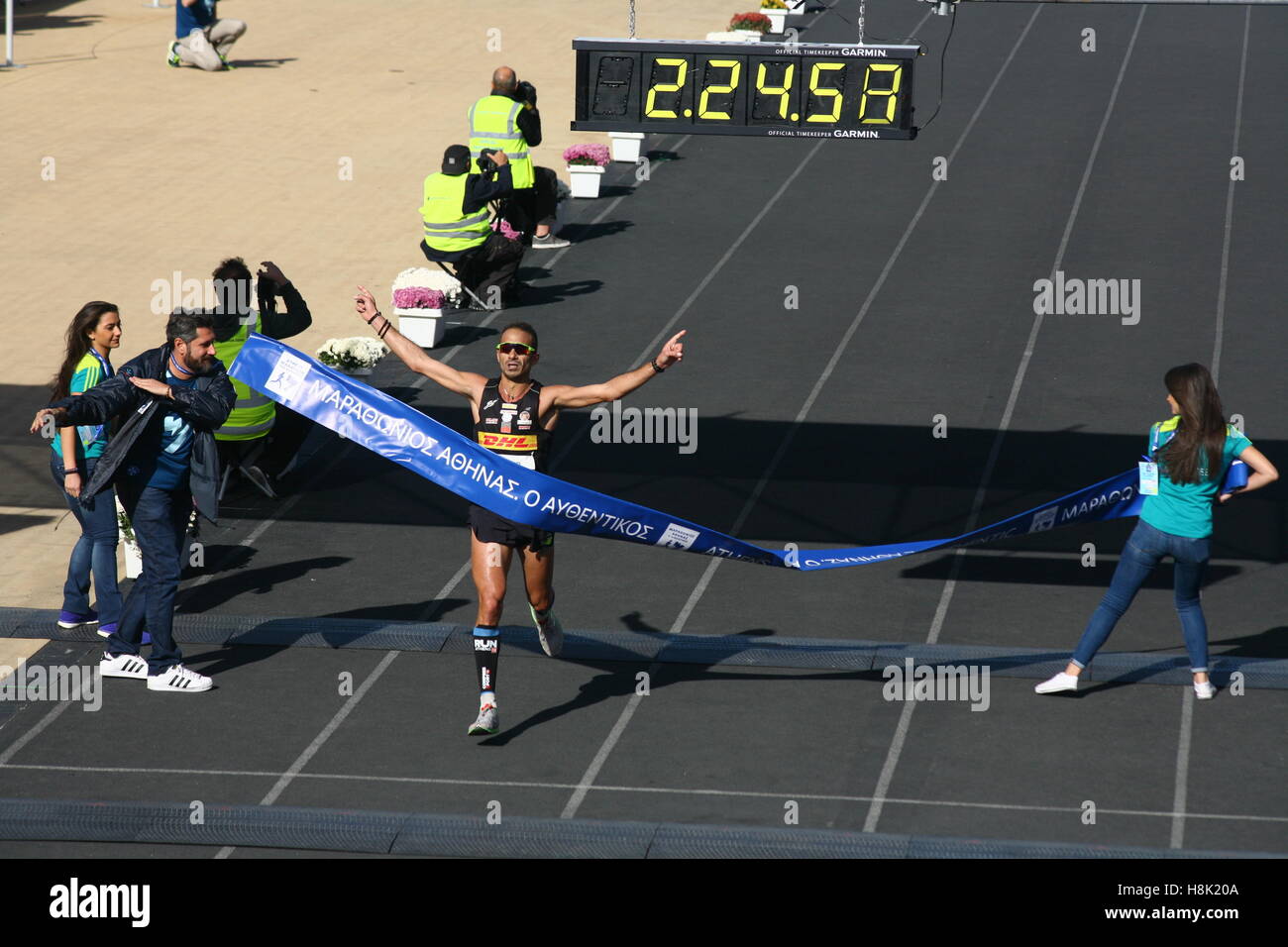 Athens, Greece. 13th Nov, 2016. The first Greek runner to finish the ...