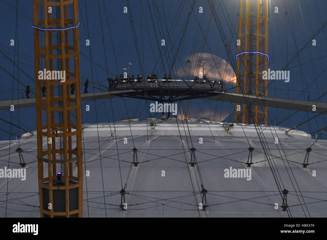 The moon rises over the O2 Arena in south-east London, as a rare ...