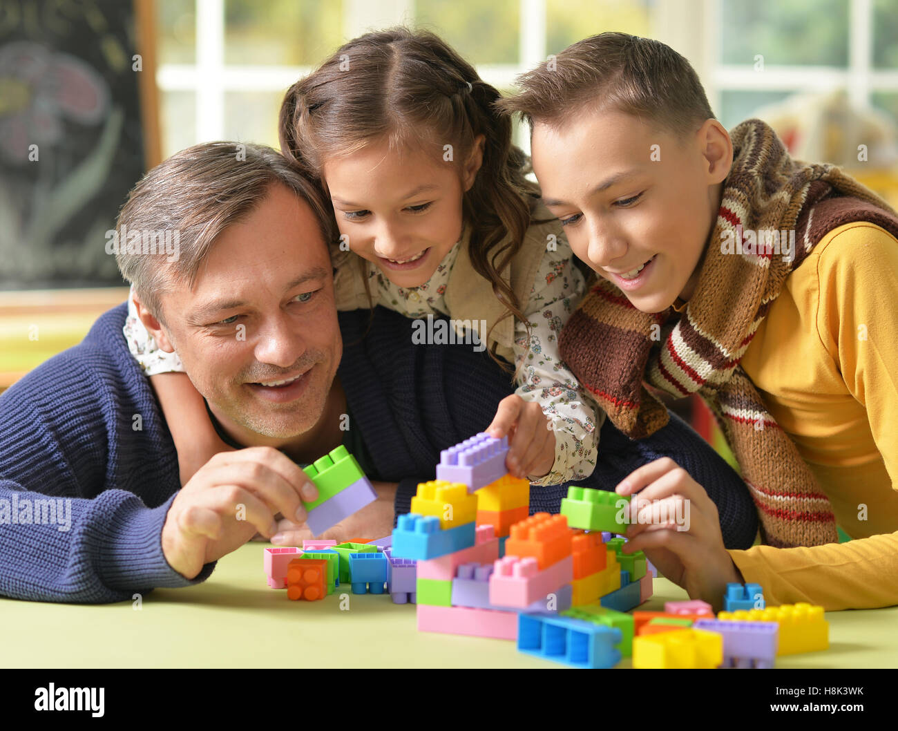 Father with kids play Stock Photo - Alamy