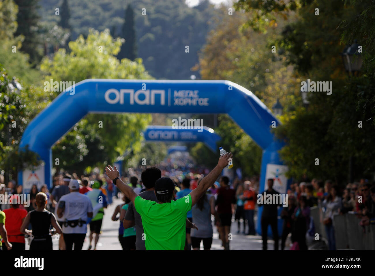 Athens, Greece. 13th Nov, 2016. Runners run down the last few hundred ...
