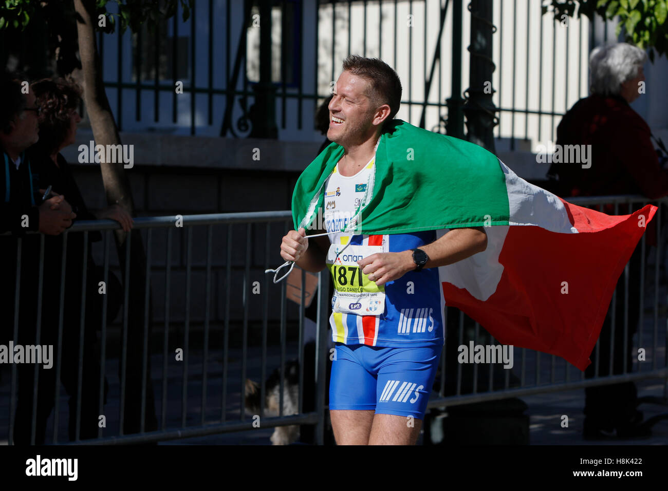 Athens, Greece. 13th Nov, 2016. A runner is wrapped in an Italian flag ...