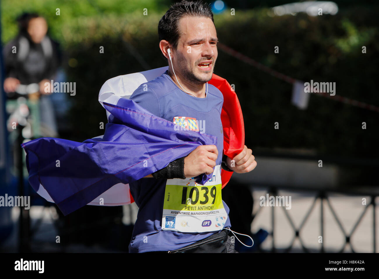 Athens, Greece. 13th Nov, 2016. A runner is wrapped in a French flag ...