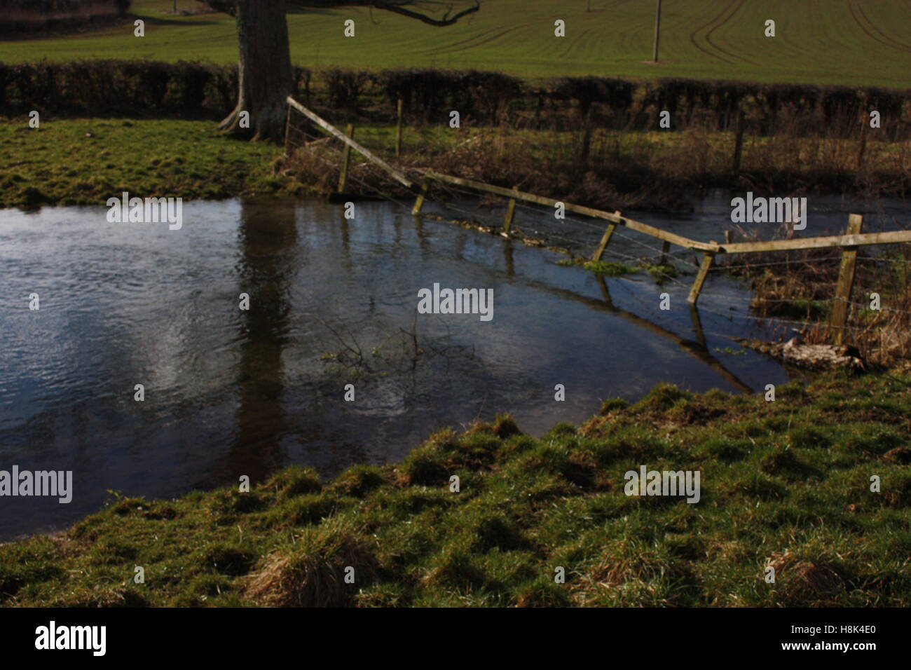Countryside setting - fence over a country river scenic background in ...
