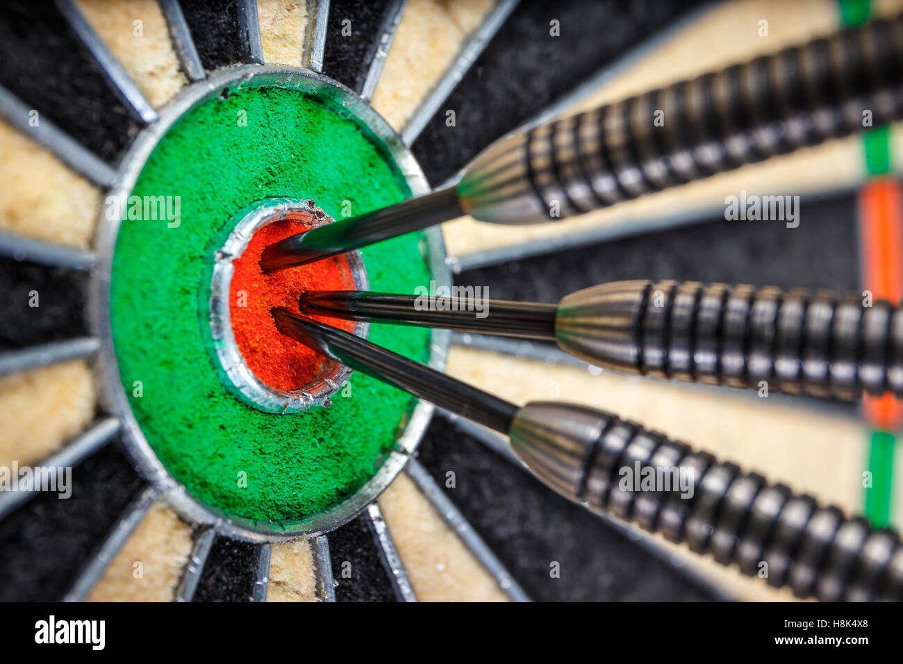 Dartboard three darts in bullseye hi-res stock photography and images ...