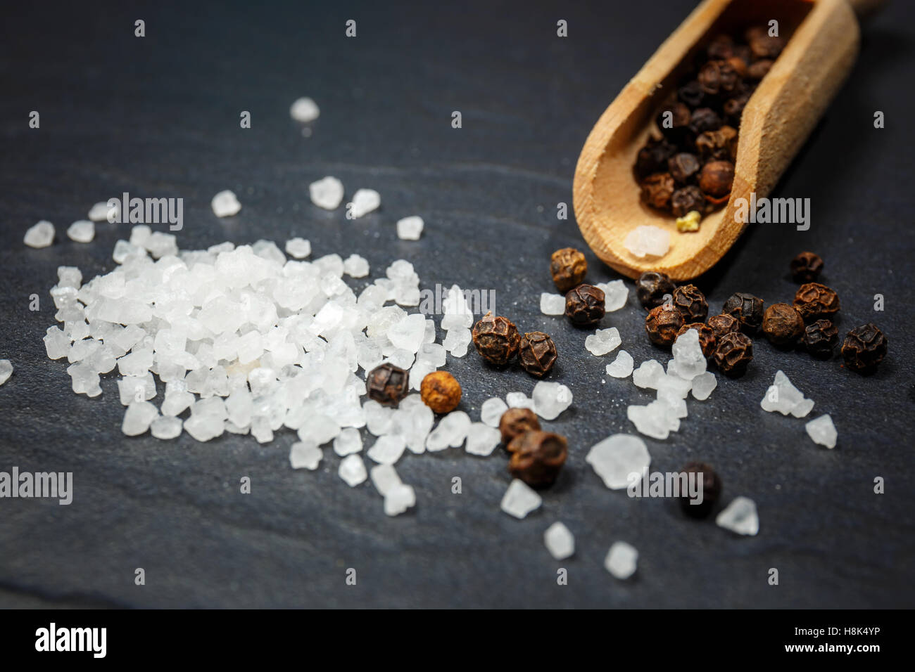 black pepper and salt on rustic stone background. Overhead view food ...