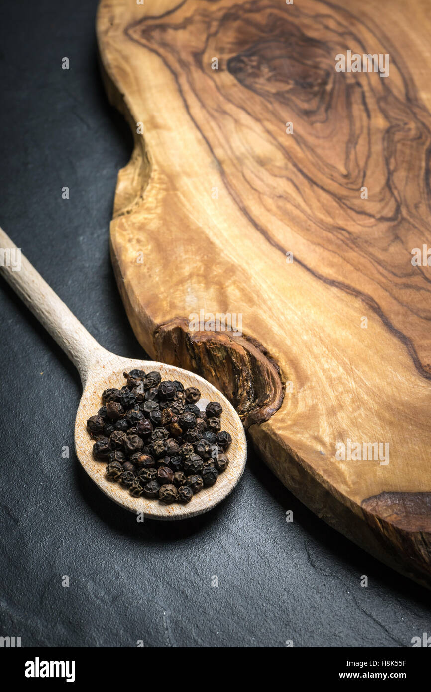 black pepper on rustic wooden table with copy space Stock Photo - Alamy