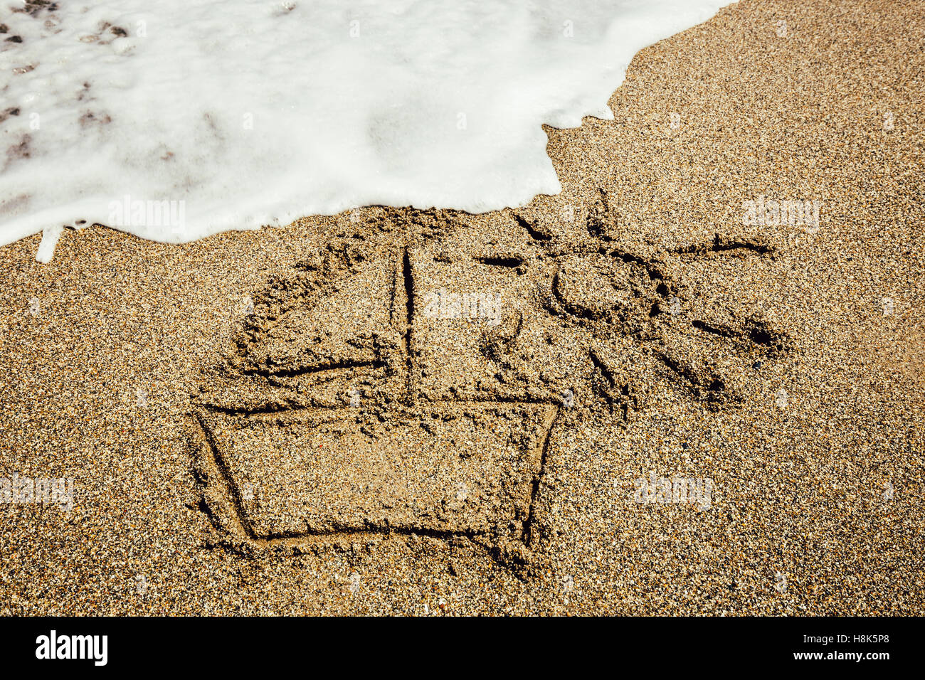 Ship painted on sand beach Stock Photo - Alamy