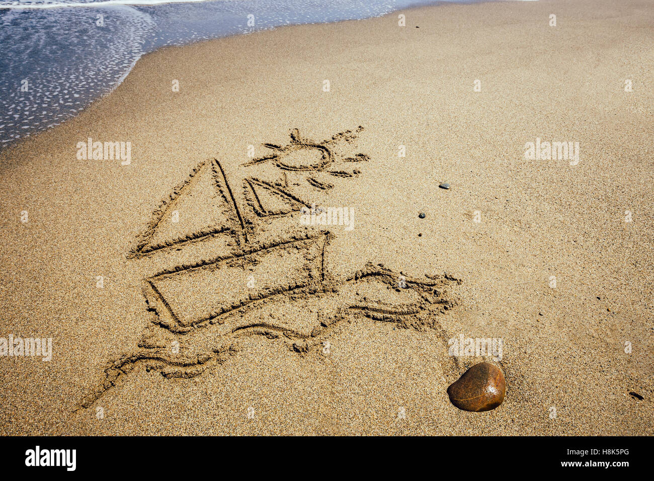 Ship painted on sand beach Stock Photo - Alamy