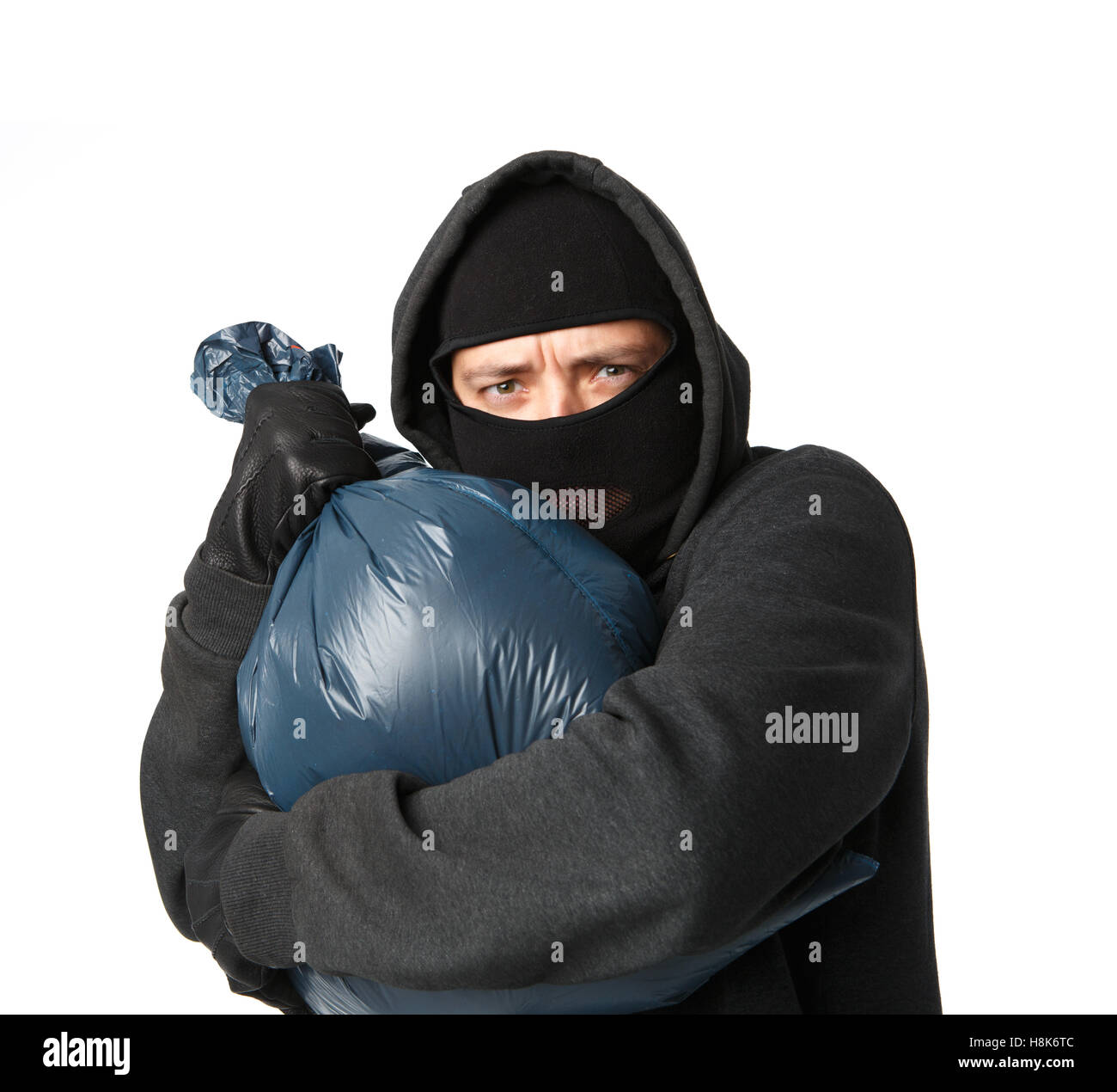 Terrible robber grabbed large bag Stock Photo - Alamy