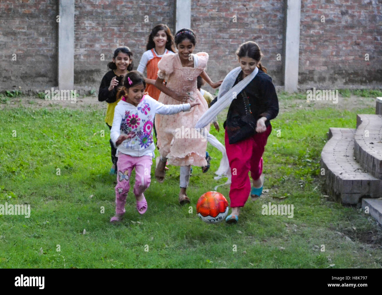 Girls in a Pakistan orphanage play with a gifted fairtrade football ...