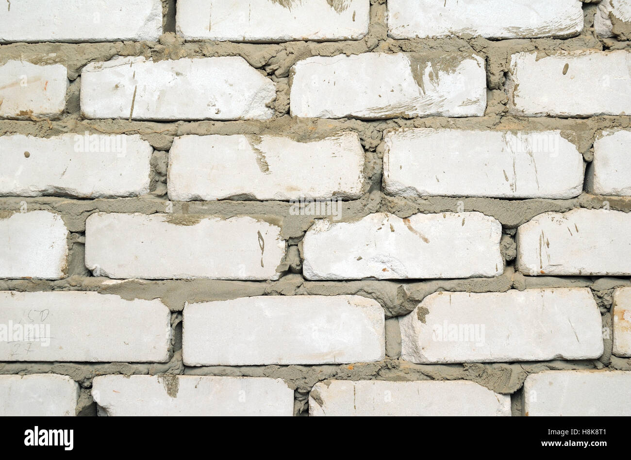 Brick wall. A bricklaying fragment. Inaccurate work Stock Photo - Alamy