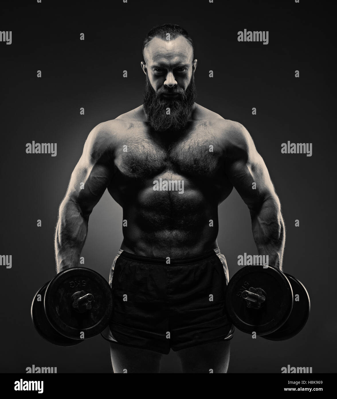 Strong bodybuilder with six pack, perfect abs, shoulders, biceps ...