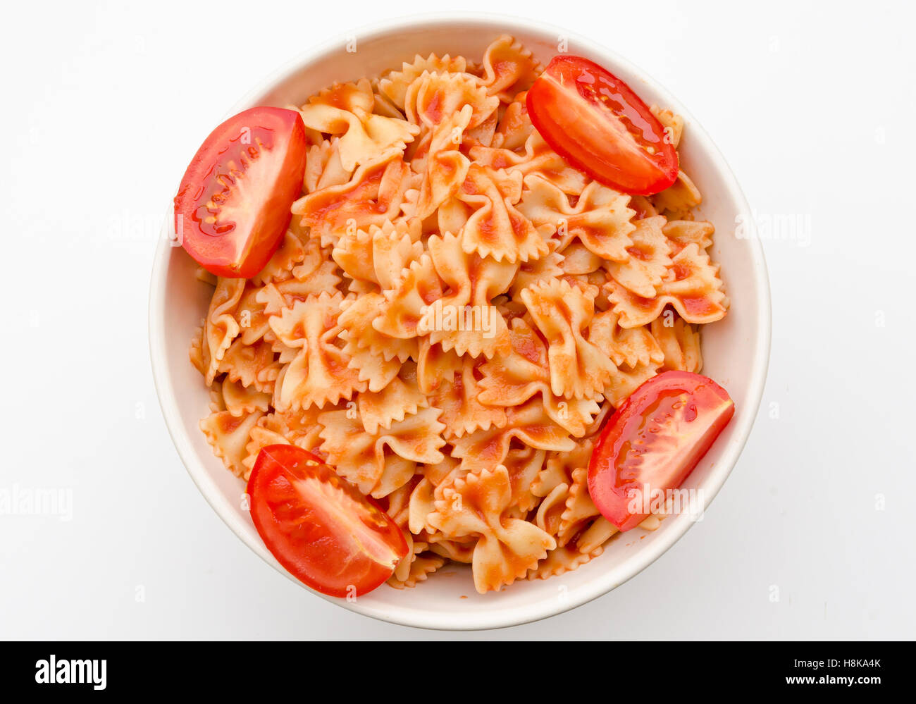 Pasta and tomato sauce in white circle shape bowl Stock Photo - Alamy