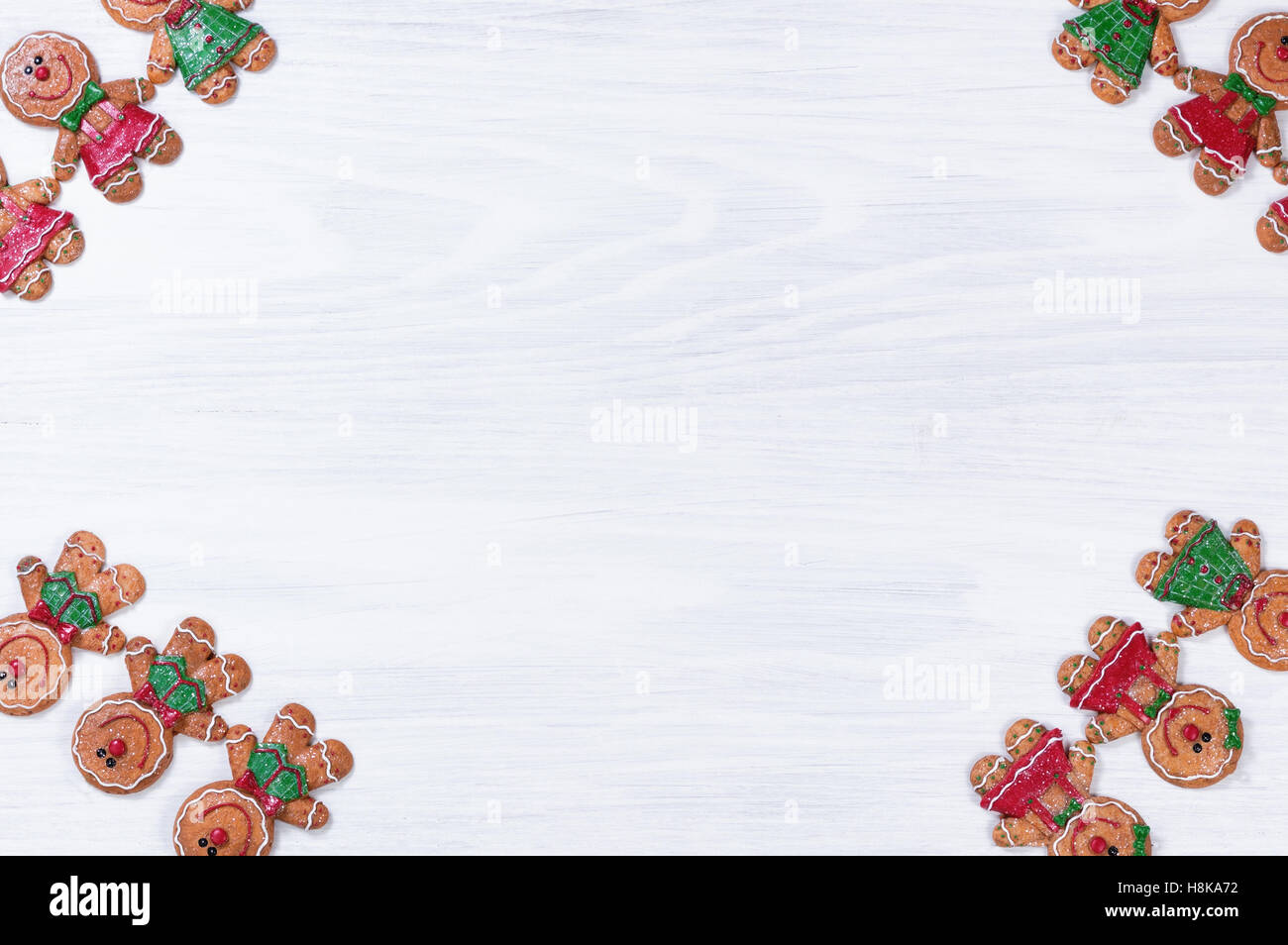 Christmas holiday cookies in each corner on white wood Stock Photo - Alamy