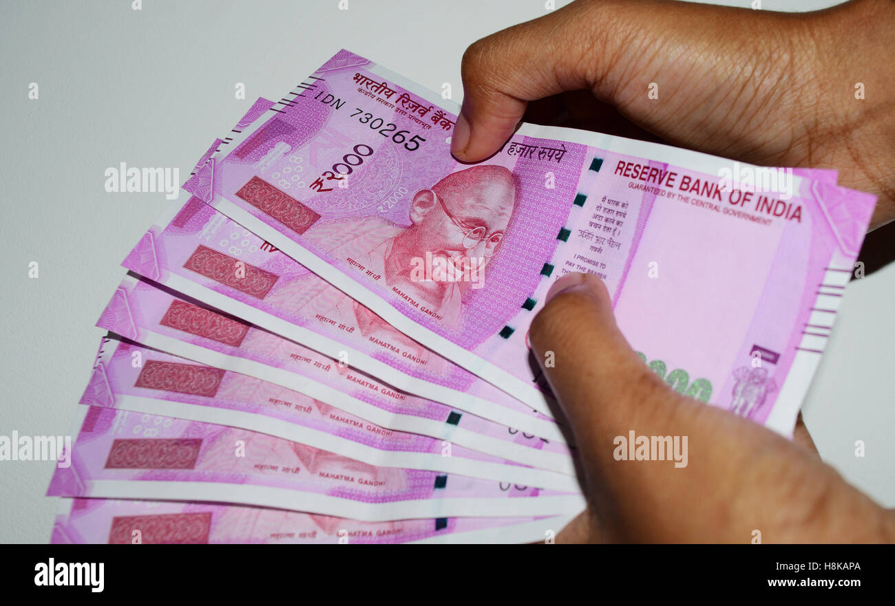 Counting Indian currency 2000 two thousand rupees Banknotes Stock Photo ...