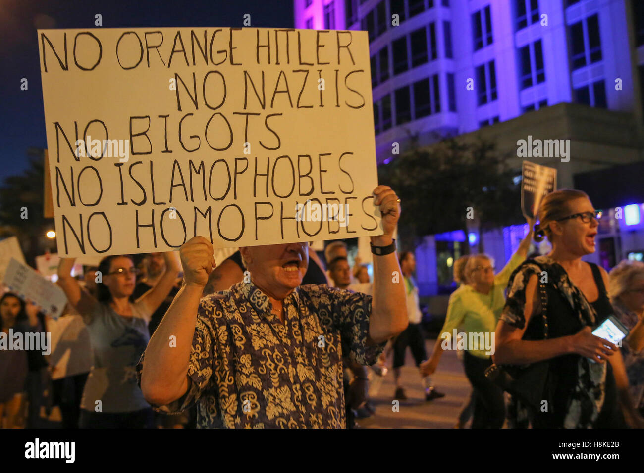 Protestors hold up placards at an anti Donald Trump rally on 13th ...