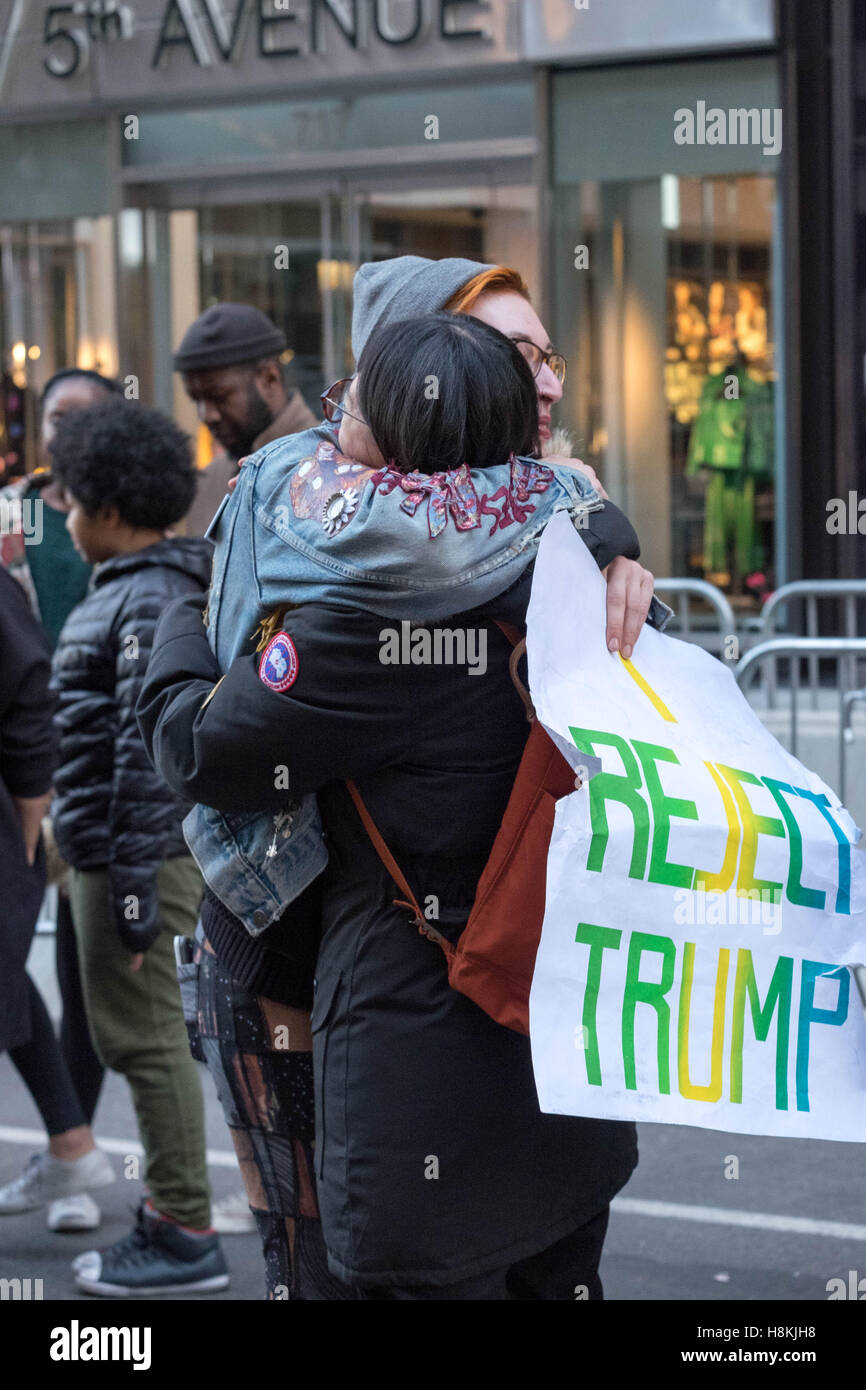 New York, USA. 13th November, 2016. Two women protestors embrace, one ...