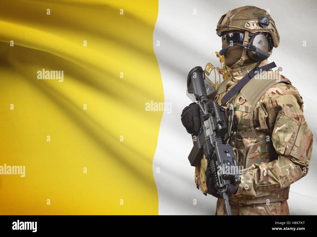 Soldier in helmet holding machine gun with national flag on background ...