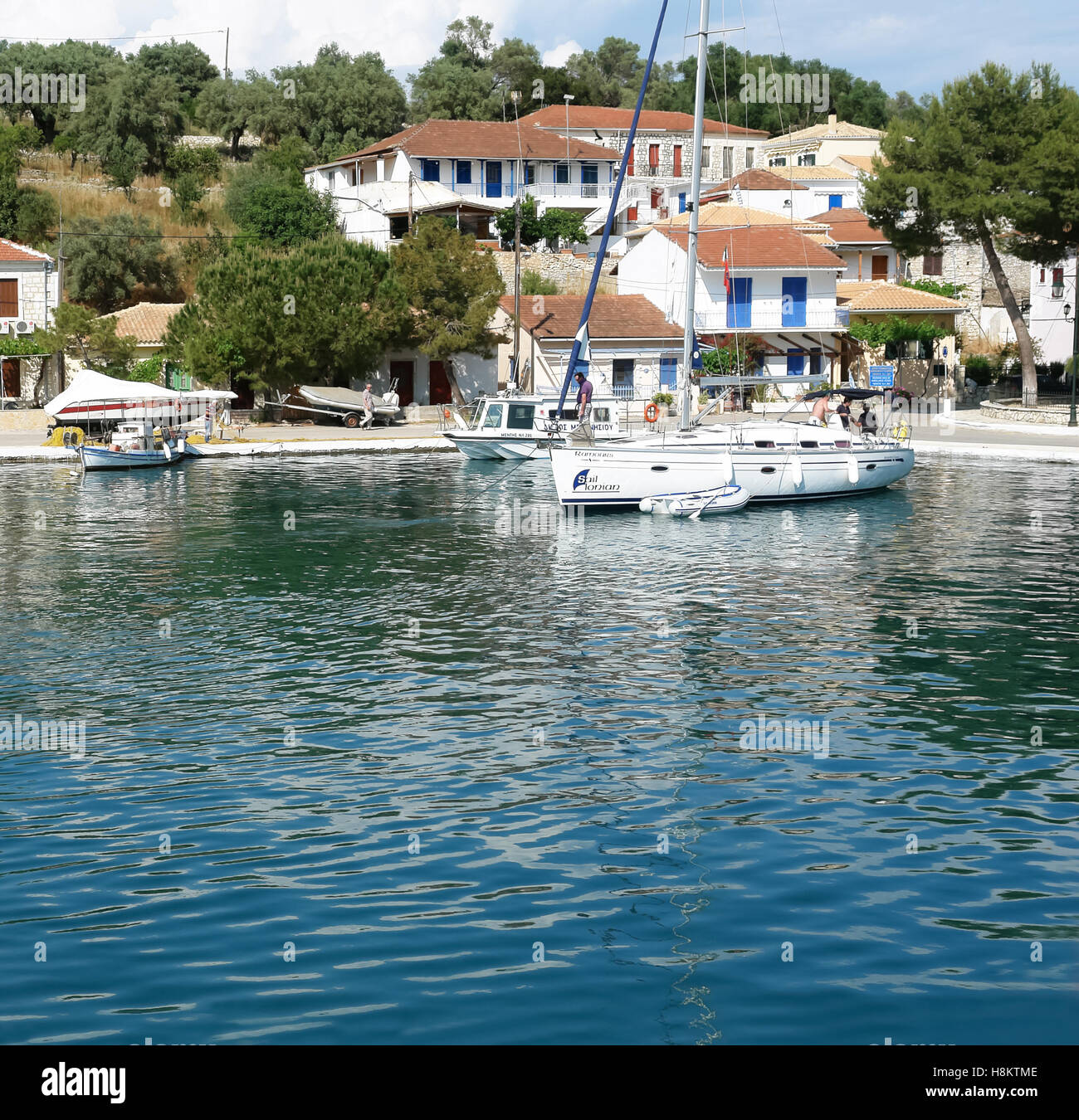Vathi, GREECE, May 11, 2013: Landscape with mooring and yacht in port ...