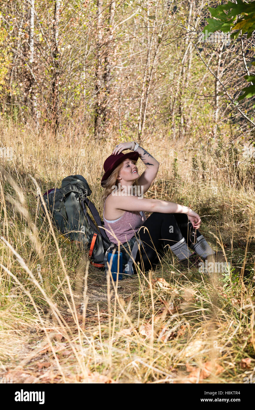 Beautiful woman backpacking in wilderness Stock Photo - Alamy