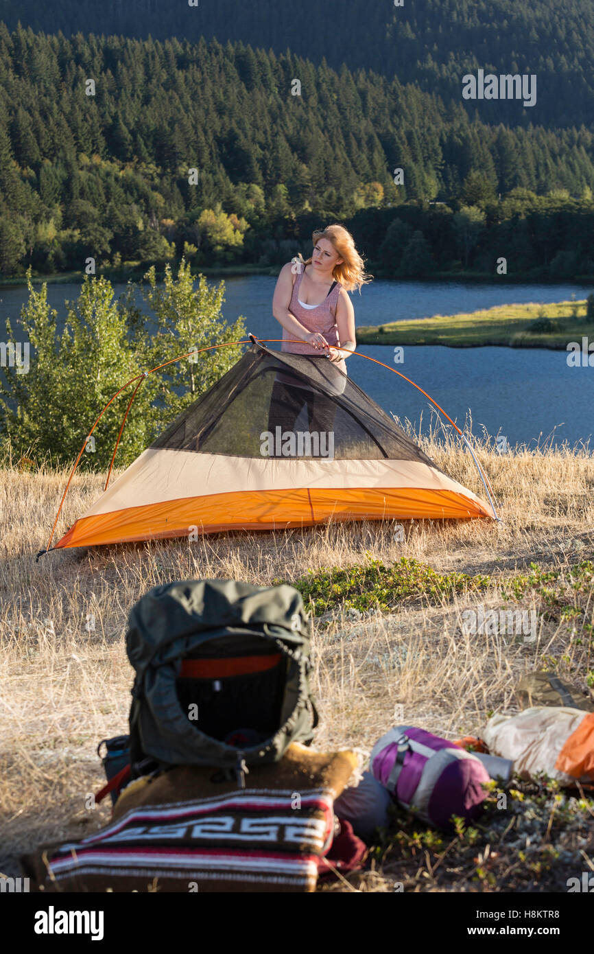 Beautiful woman backpacking in wilderness Stock Photo - Alamy