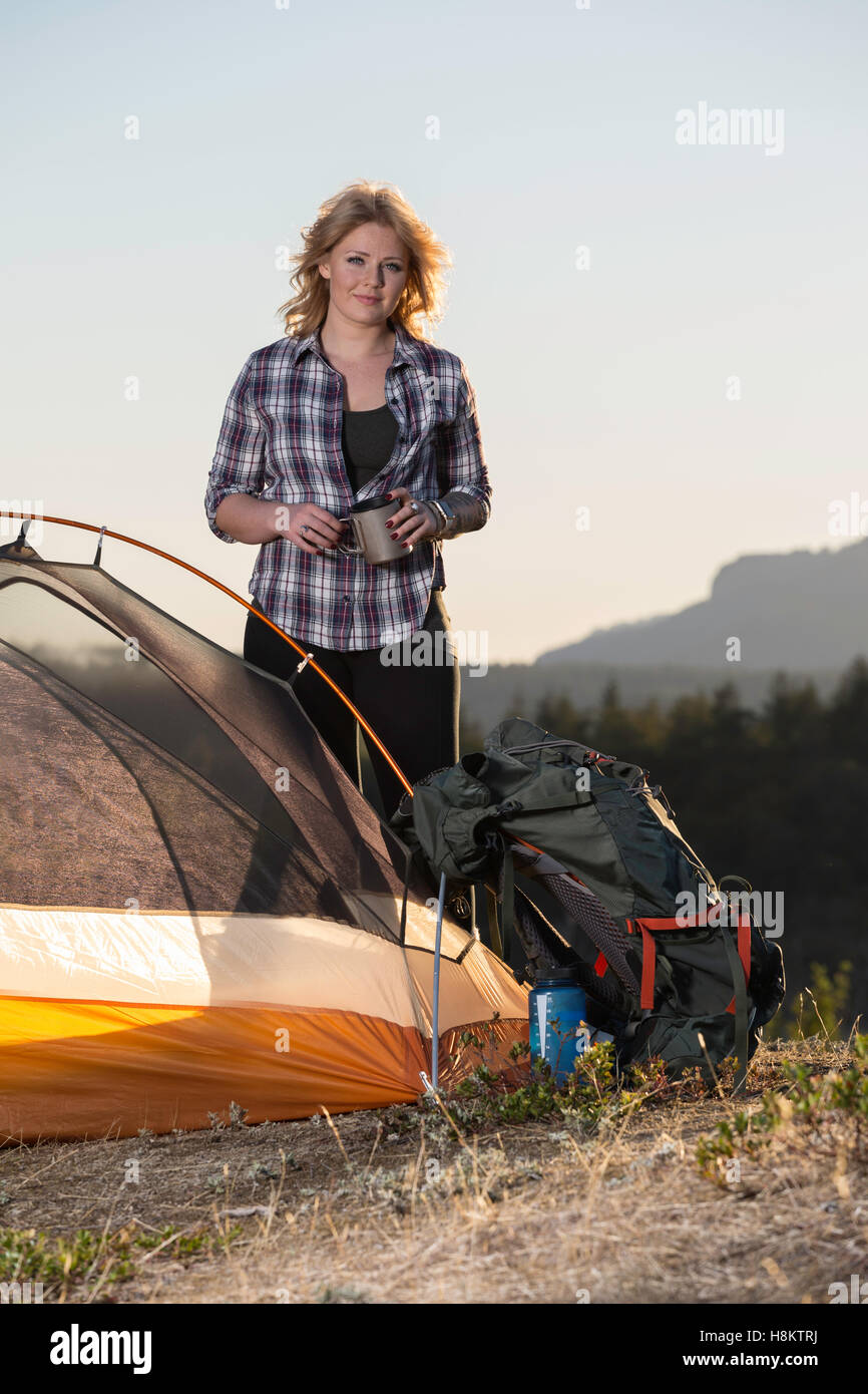 Beautiful woman backpacking in wilderness Stock Photo - Alamy