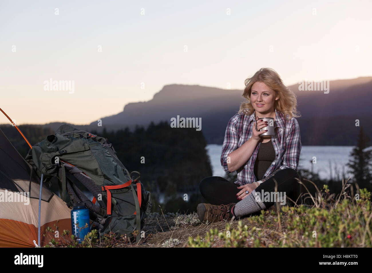 Beautiful woman backpacking in wilderness Stock Photo - Alamy