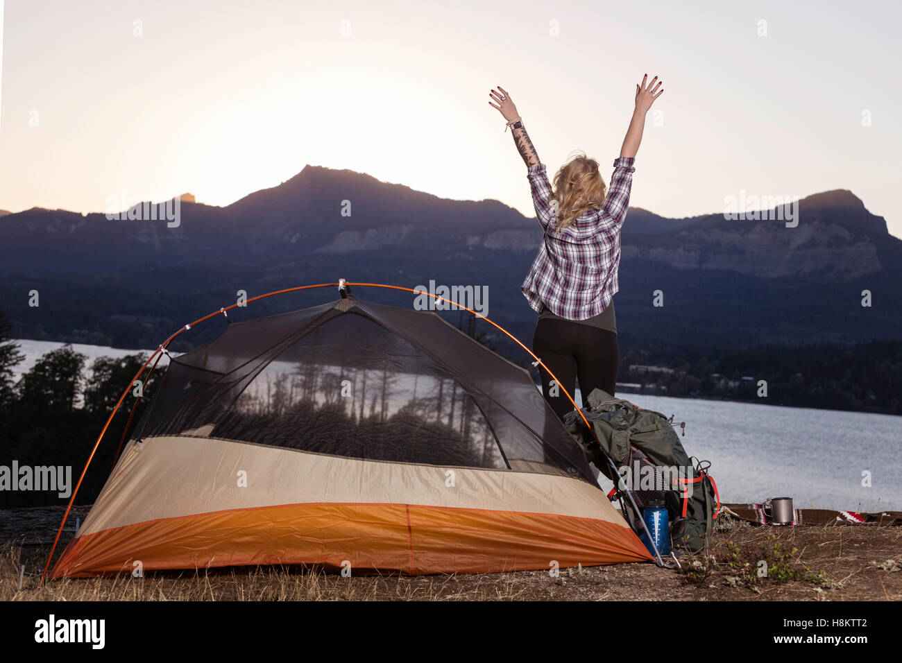 Beautiful woman backpacking in wilderness Stock Photo - Alamy