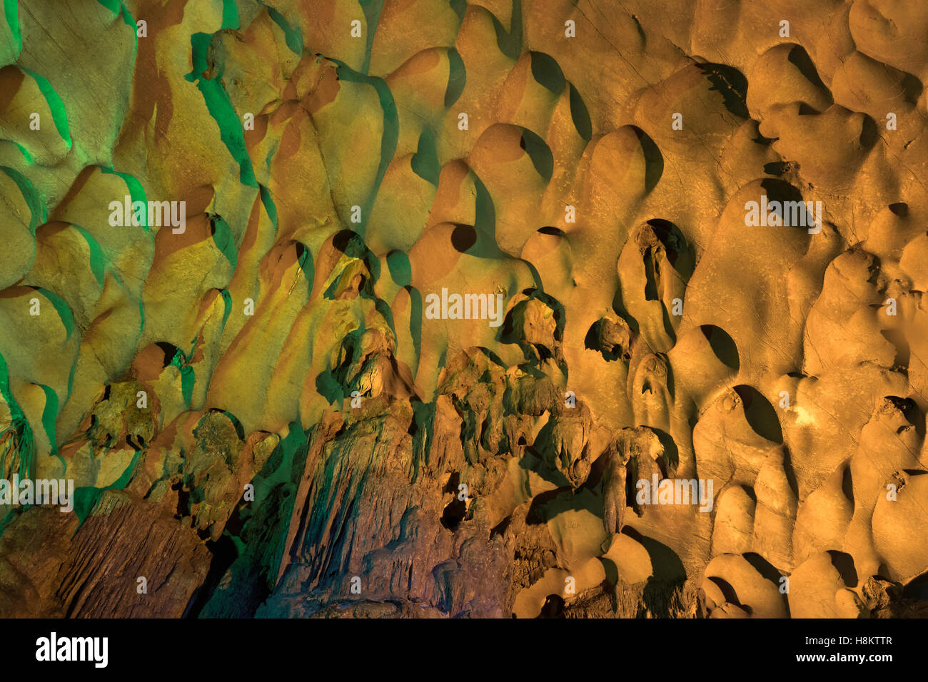 Large concave pockets carved by water on the ceiling of Sung Sot Cave ...