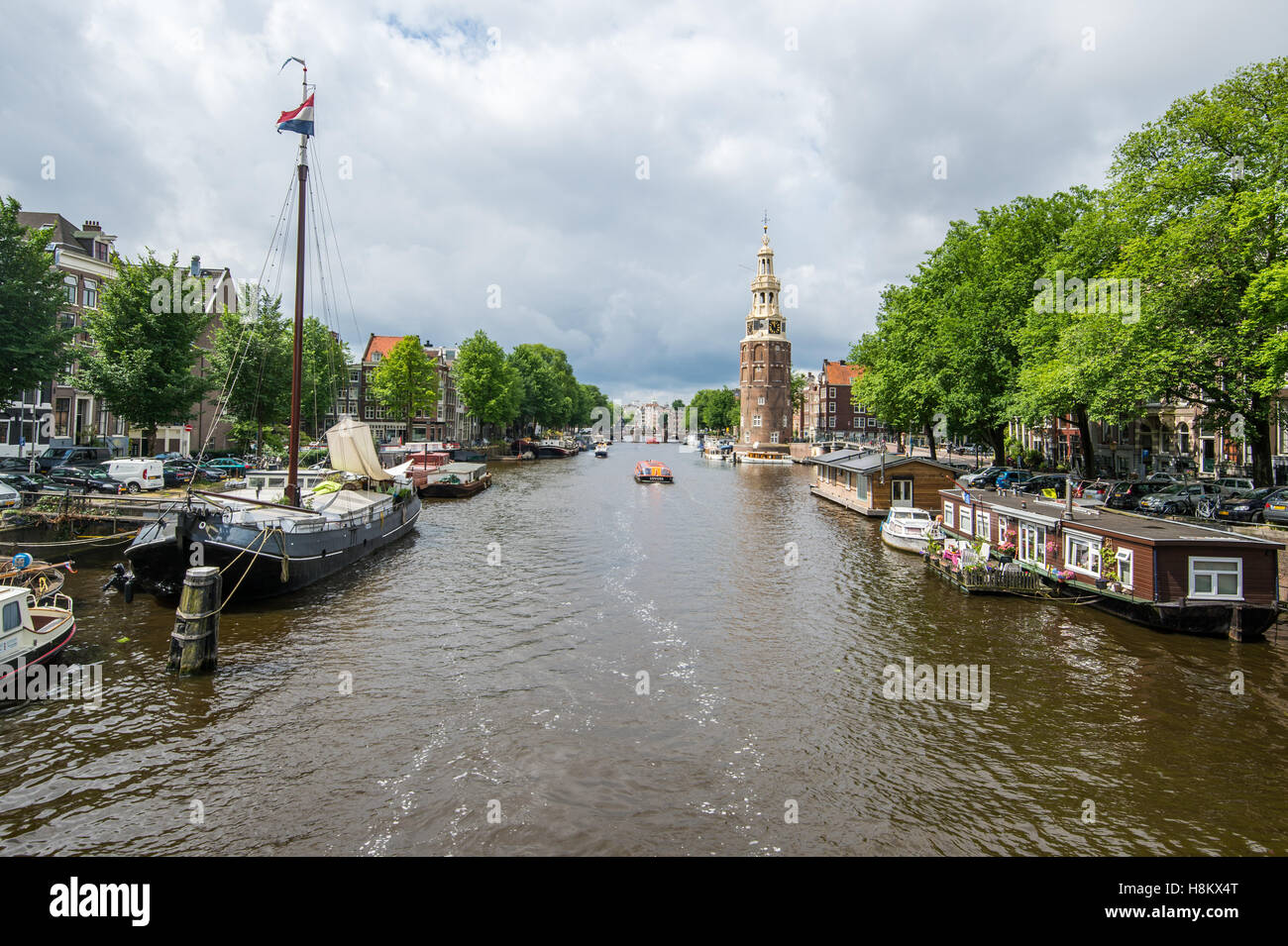 Amsterdam, Netherlands waterfront view of boats sailing through an ...