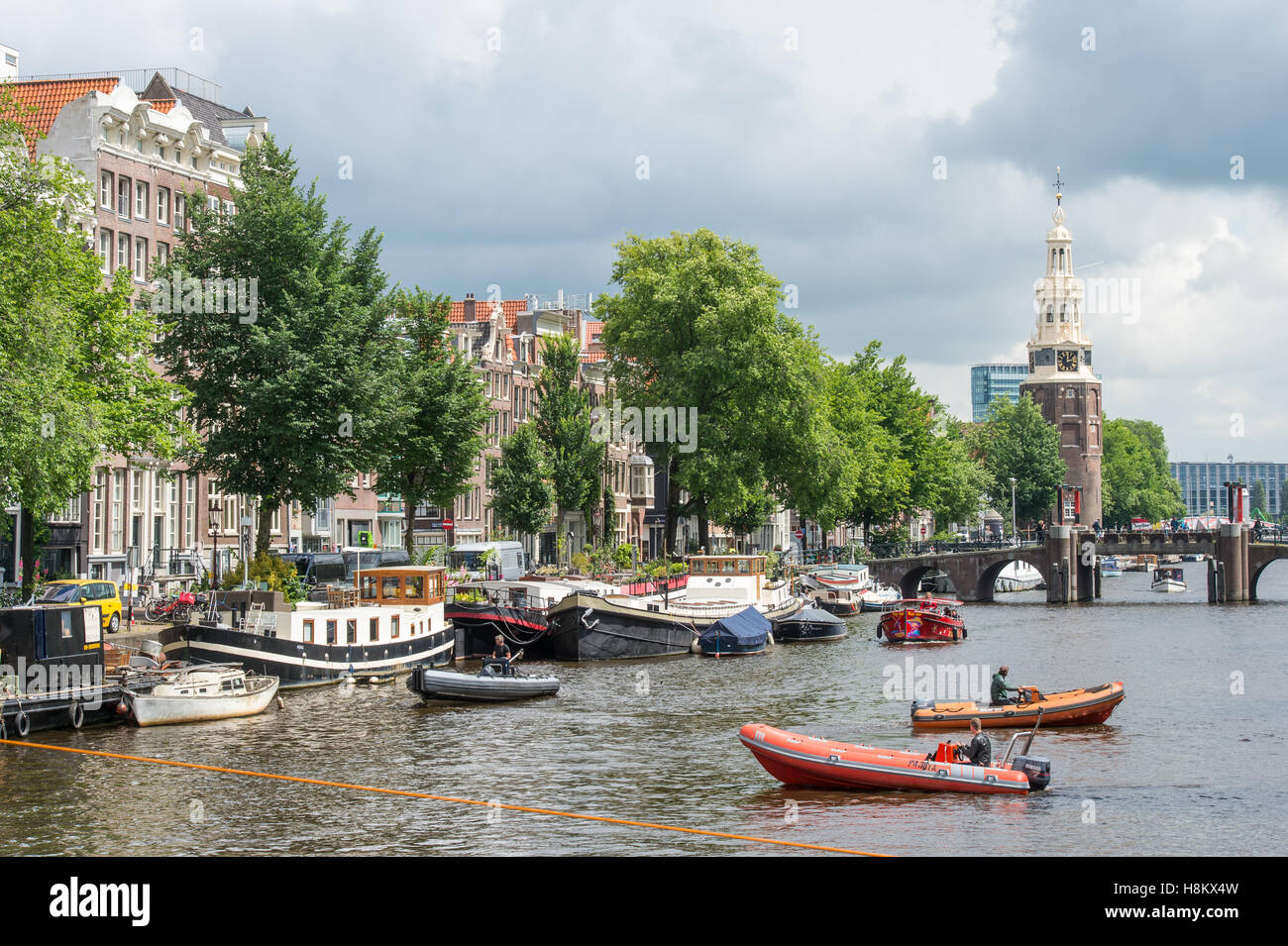 Amsterdam, Netherlands waterfront view of boats sailing through an ...