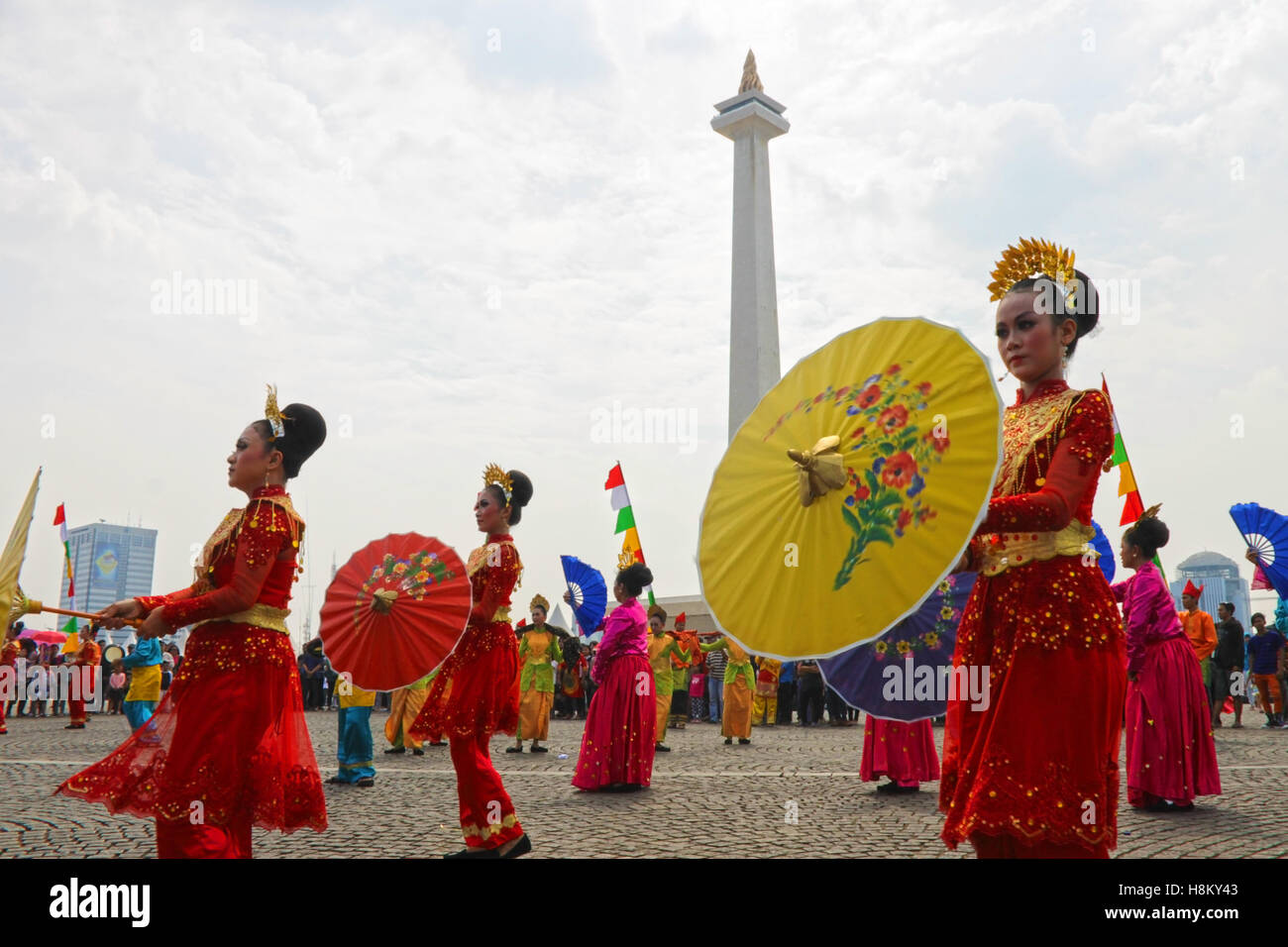 Beautiful dancers in traditional costume from Jambi, Indonesia shows an ...