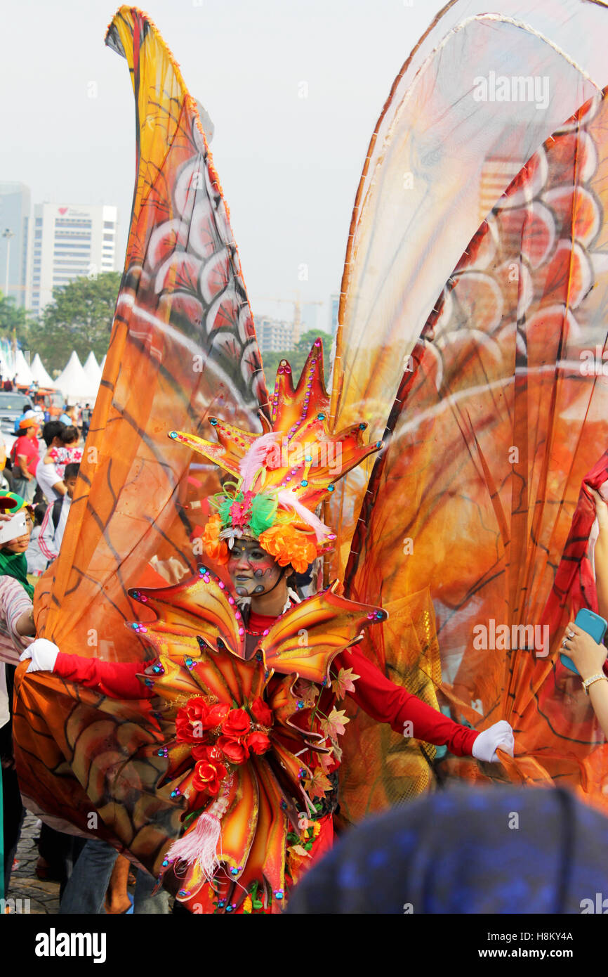A woman model in colorful giant butterfly contemporary art costume ...