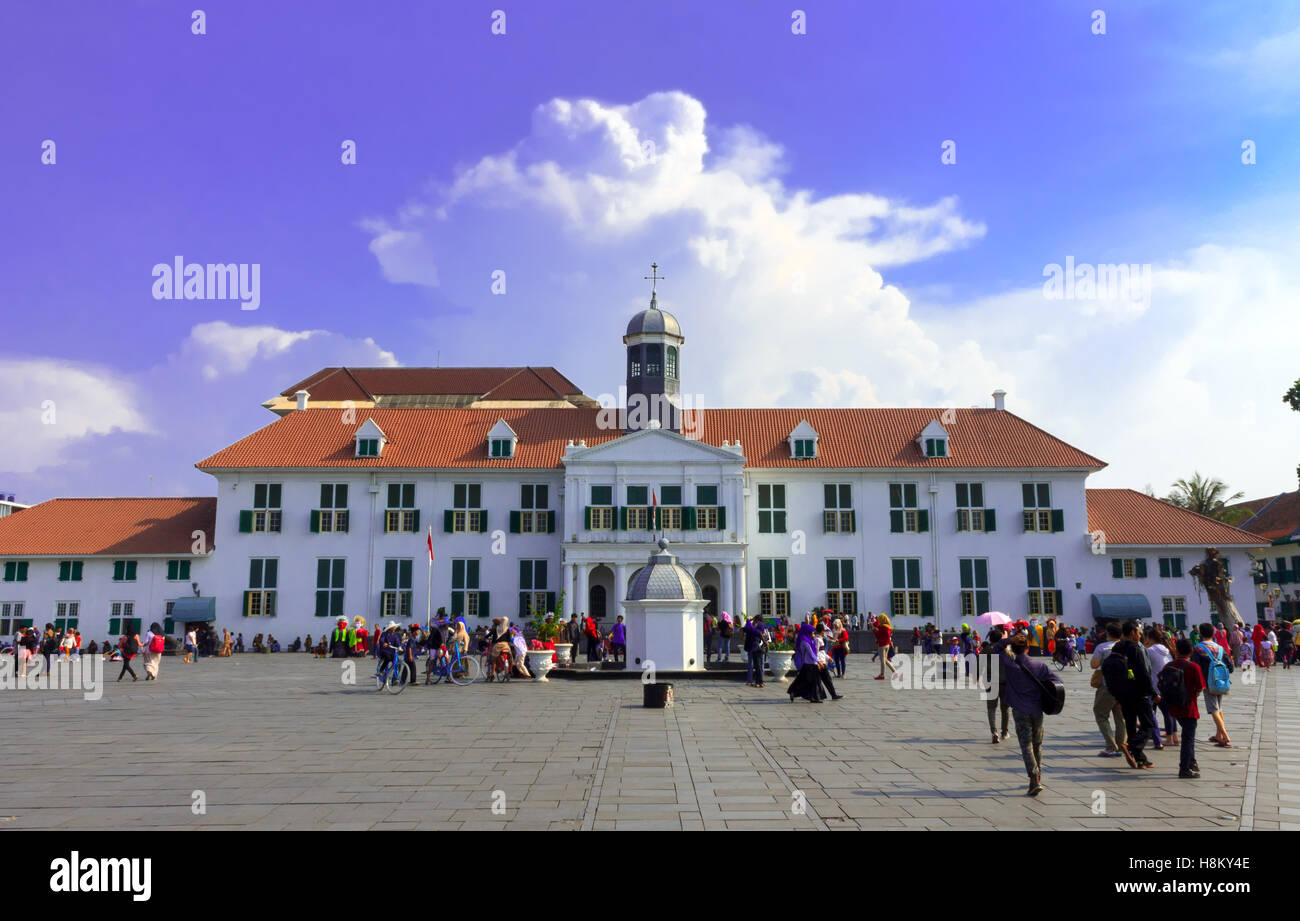 Tourists visiting a historical building at Fatahillah Square which was ...