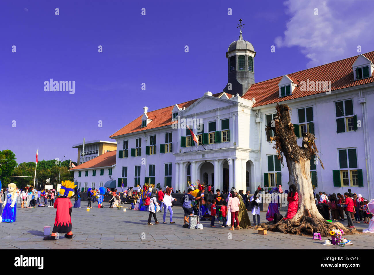 Tourists visiting a historical building at Fatahillah Square which was ...