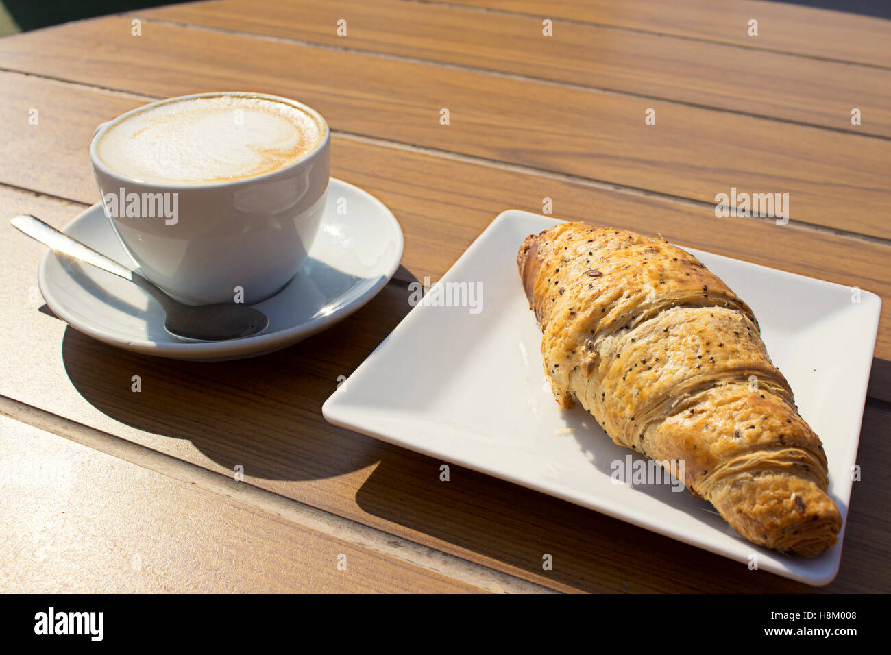 Italian typical creamy hot Cappuccino with five cereals light brioche ...